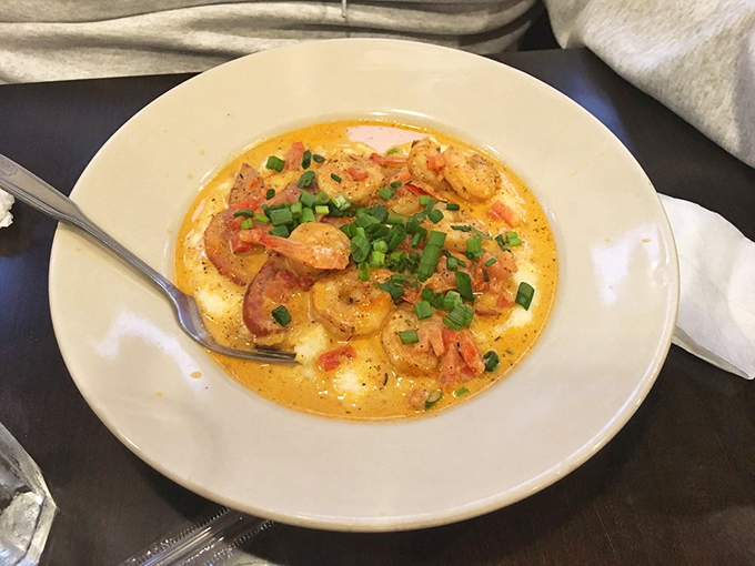 Shrimp and grits swimming in a creamy sauce that's so good you'll be tempted to ask for a straw. No judgment here.
