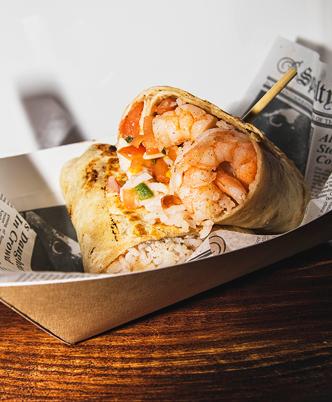 Plump shrimp nestled in a grilled tortilla with fresh veggies&mdash;this burrito means serious business in the best possible way.