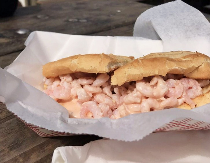 Pink treasures from the bay nestled in golden bread. This shrimp sandwich isn't just lunch; it's the coastal California experience in handheld form.