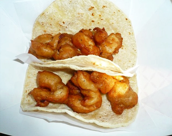 The golden-battered shrimp tacos arrive unadorned, like talented actors waiting for you, the director, to add the perfect garnishes.