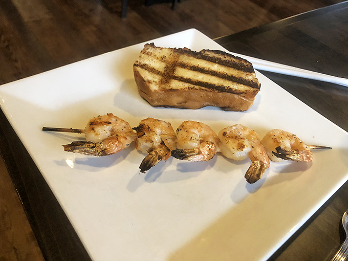 These grilled shrimp aren't just seafood; they're little ocean ambassadors visiting your landlocked steak, bringing coastal greetings to your plate.