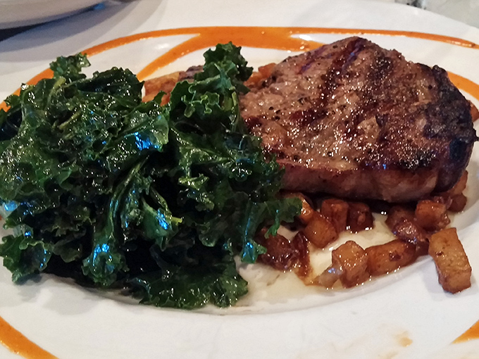 A perfectly seared steak nestled on greens &ndash; proof that sometimes dinner can be both virtuous and indulgent.