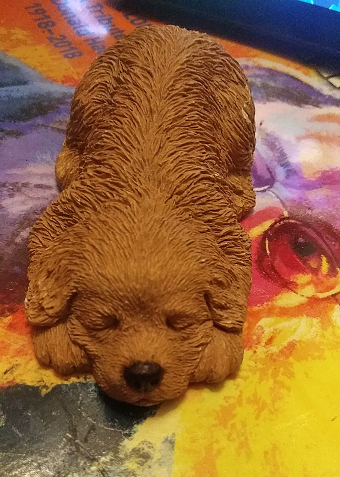 This sleeping puppy figurine is just waiting to guard someone's bookshelf. Quirky decor finds like this give homes personality without breaking the bank.