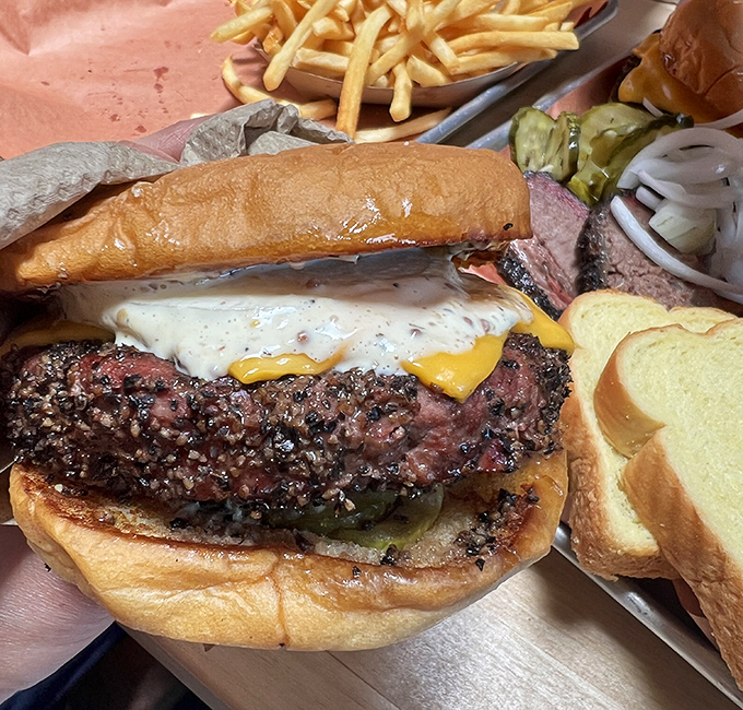 A smoked brisket burger that requires both hands, a stack of napkins, and possibly a post-meal nap. That bark-crusted patty is what dreams are made of.