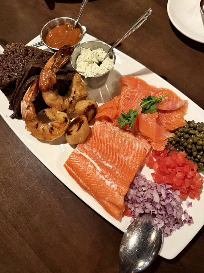 Ocean meets artistry on this seafood platter. Those salmon slices are practically blushing with pride, while the shrimp stand at attention like they know they're special.