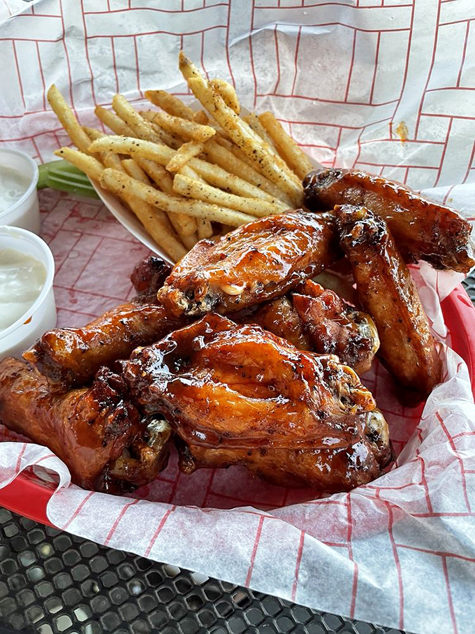 These wings aren't just smoked, they're transformed &ndash; glistening with sauce and paired with fries that clearly didn't come from a freezer bag.