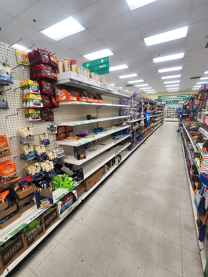 The snack aisle: where willpower goes to die and impulse purchases are born. Empty shelves tell tales of Georgia's favorite munchies.