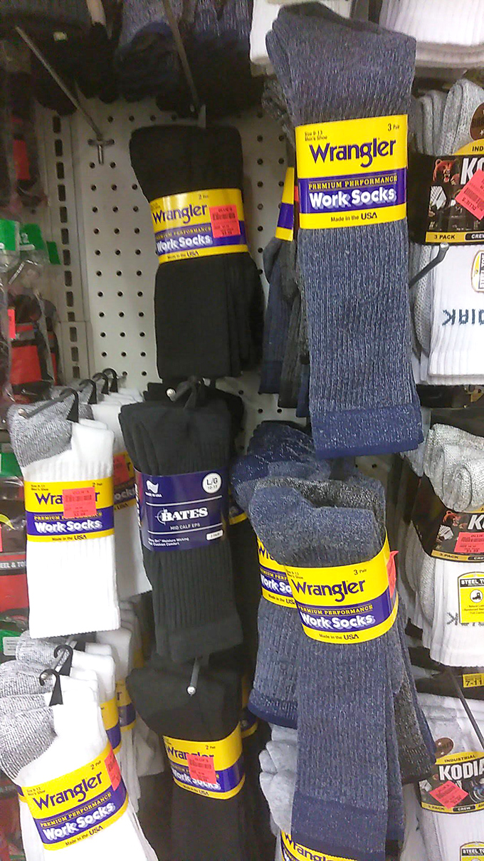 The sock aisle &ndash; where Wrangler work socks hang like textile trophies, proving even practical purchases can feel like victories at these prices.