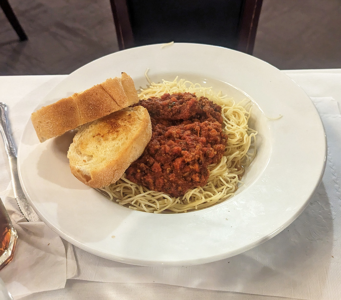 Spaghetti with meat sauce and garlic bread&mdash;proof that comfort food doesn't need a fancy pedigree to make you feel like royalty.