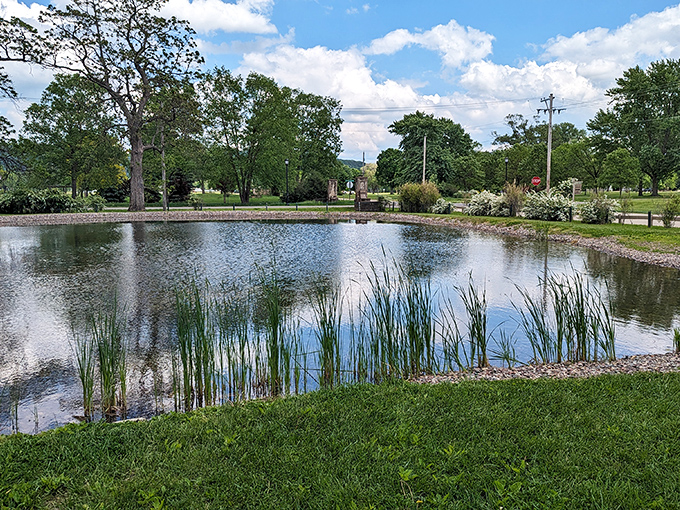 This serene park pond reflects more than clouds&mdash;it mirrors the peaceful pace that makes retirees toss their alarm clocks into yard sales.