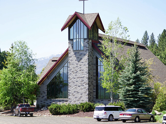St. Katharine Drexel Catholic Church's striking stone and glass architecture reflects both mountain grandeur and spiritual elevation&mdash;Sunday services with a view.