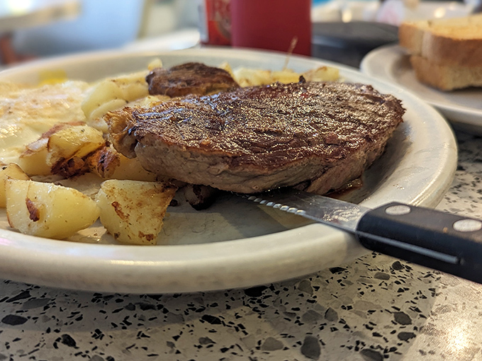 When a steak arrives with that perfect sear alongside golden potatoes, you know someone in the kitchen actually cares.
