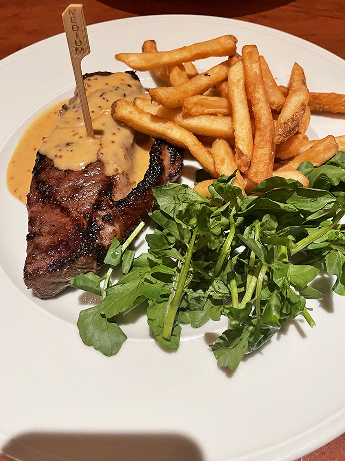 The steak frites here doesn't need a passport to transport you to Paris. That peppercorn sauce deserves its own fan club.