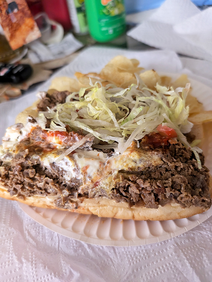 Meat, peppers, and cheese performing a culinary ballet on bread &ndash; the kind of sandwich that ruins all other lunches forever.