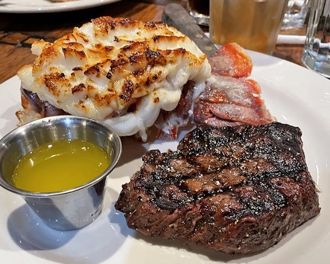 The ultimate land-and-sea compromise: a perfectly grilled steak playing wingman to a lobster tail that clearly dressed up for the occasion.
