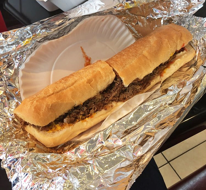 The humble cheesesteak, wrapped in foil like the gift it truly is, proves that sometimes the simplest pleasures are the most satisfying.