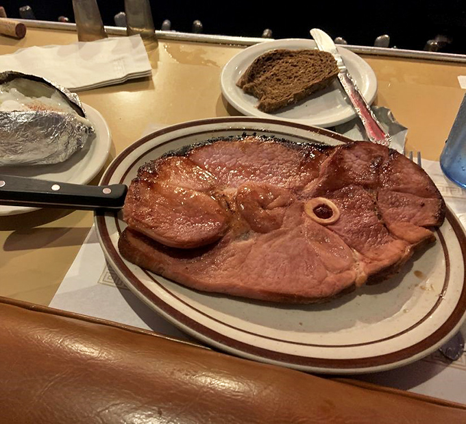 The ham steak arrives like a carnivore's dream&mdash;substantial, perfectly seared, and ready to transport you to comfort food paradise.