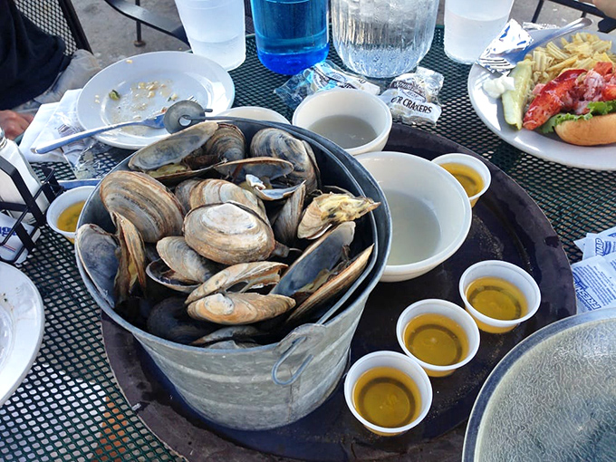 A bucket of steamed clams surrounded by golden cups of drawn butter&mdash;nature's perfect excuse to roll up your sleeves and get deliciously messy.
