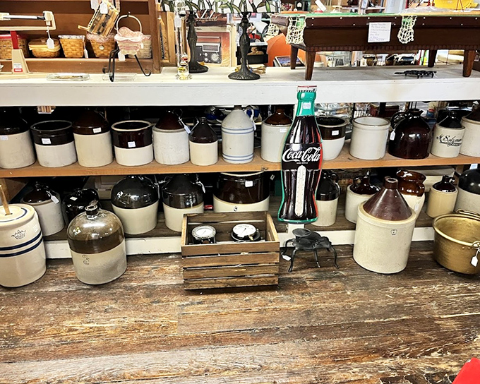 The stoneware collection could stock a pioneer general store, with that Coca-Cola bottle standing sentinel among the crocks like a fizzy anachronism.