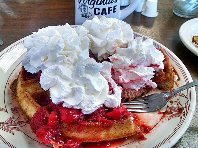 Strawberry waffles crowned with whipped cream mountains that would make even the most dignified adult forget table manners. Worth every sticky finger.