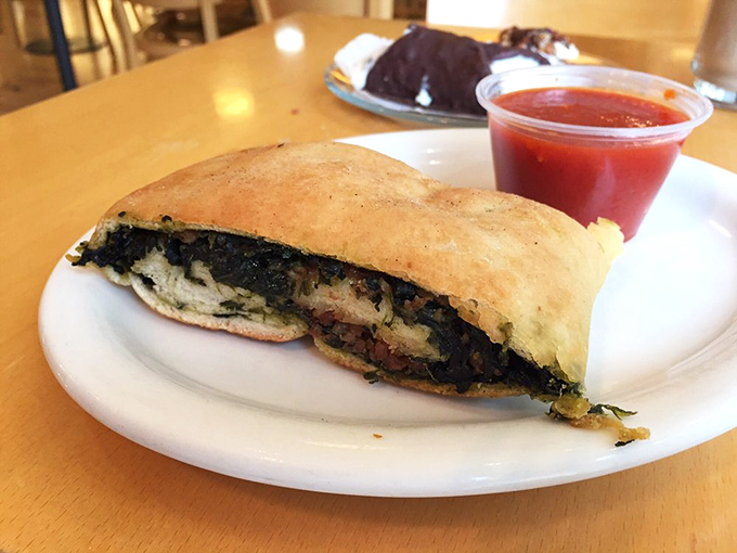That spinach stromboli isn't just lunch; it's a portable Italian vacation wrapped in golden dough, with marinara sauce standing by for the perfect dip.