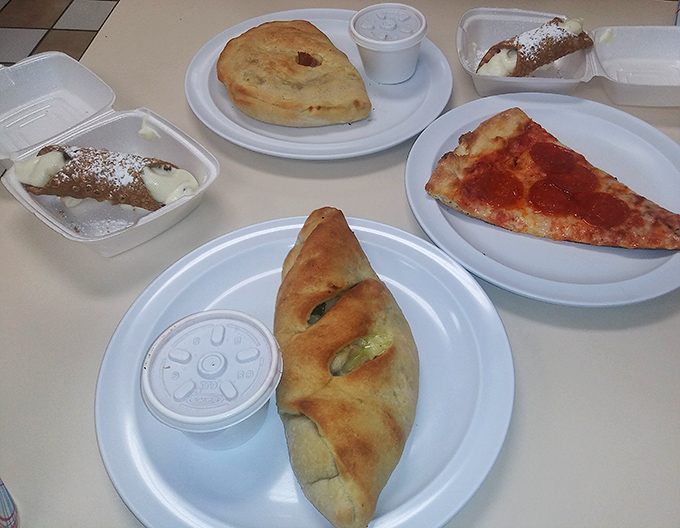 Golden-brown stromboli alongside cannoli&mdash;the Italian version of "I couldn't decide, so I ordered both." No regrets here.