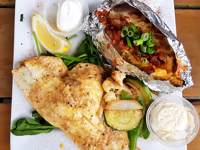 Delicate white fish meets colorful vegetables on a plate that's both a feast for the eyes and the appetite.