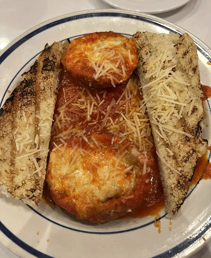 Stuffed meatballs with melted cheese and grilled bread prove that comfort food can also be absolutely gorgeous on a plate.