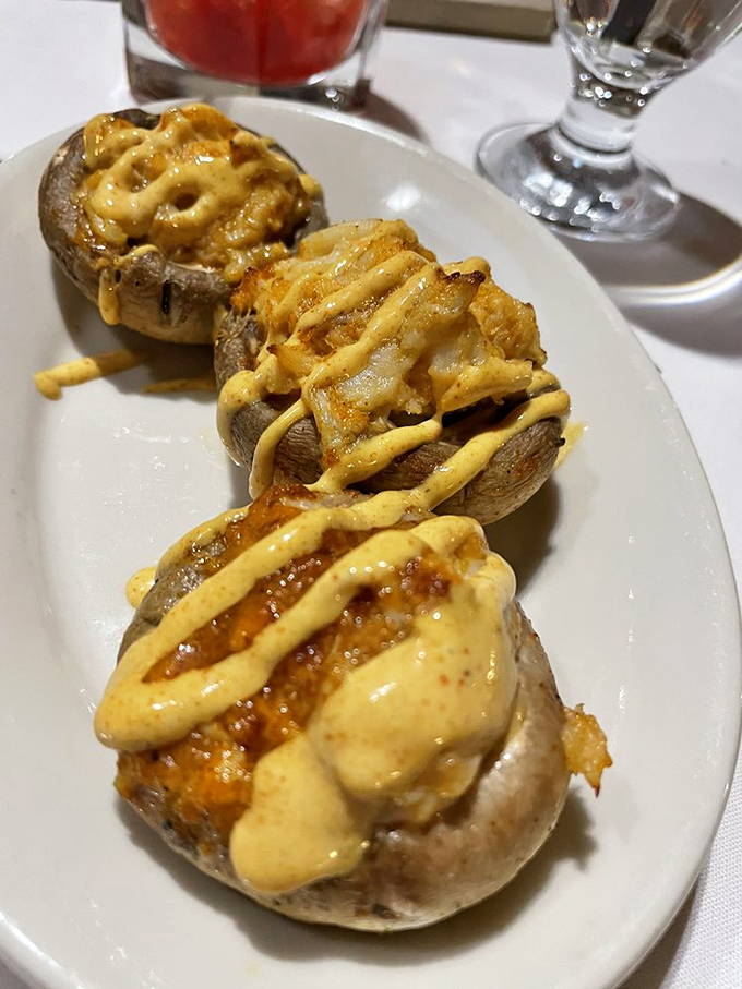 These aren't just stuffed mushrooms&mdash;they're little umami bombs drizzled with a sauce that'll have you contemplating licking the plate when nobody's looking.