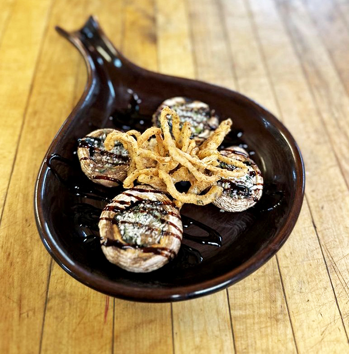 These aren't just stuffed mushrooms – they're little umami bombs drizzled with balsamic glaze that would make even a vegetable skeptic reconsider their life choices.