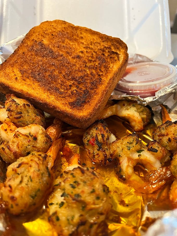 These aren't just shrimp &ndash; they're little flavor bombs disguised as seafood, served alongside golden garlic toast that's begging to soak up every last drop.