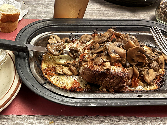A tenderloin that's achieved nirvana &ndash; perfectly seared, topped with mushrooms, and melting faster than Wisconsin snow in April sunshine.