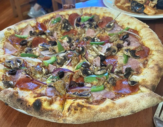Pizza this loaded should come with a structural engineering degree &ndash; just look at that glorious chaos of toppings.