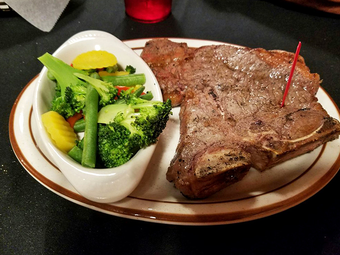 The T-bone: where filet mignon meets strip steak in meaty matrimony. Those vegetables aren't just garnish&mdash;they're there to ease your conscience.