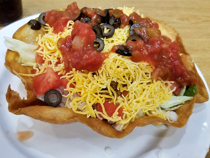 This taco salad arrives in its own edible bowl, solving the age-old dilemma of what to eat first.