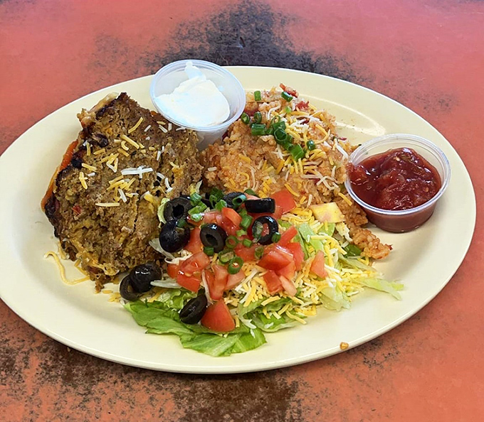 Taco meatloaf with Spanish rice&mdash;proof that culinary fusion existed long before it became trendy in metropolitan restaurants.