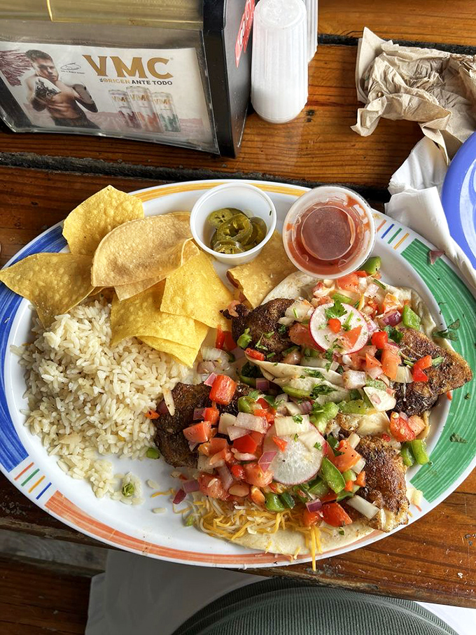 Blackened fish with fresh pico de gallo and rice. When seafood is this fresh, fancy plating would just get in the way of the main event.