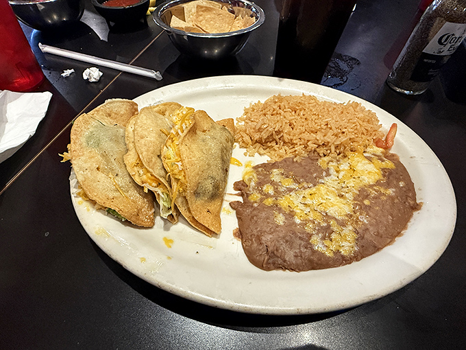 Crispy tacos arranged like soldiers guarding their treasure of seasoned fillings. The rice and beans aren't sidekicks&mdash;they're co-stars in this production.