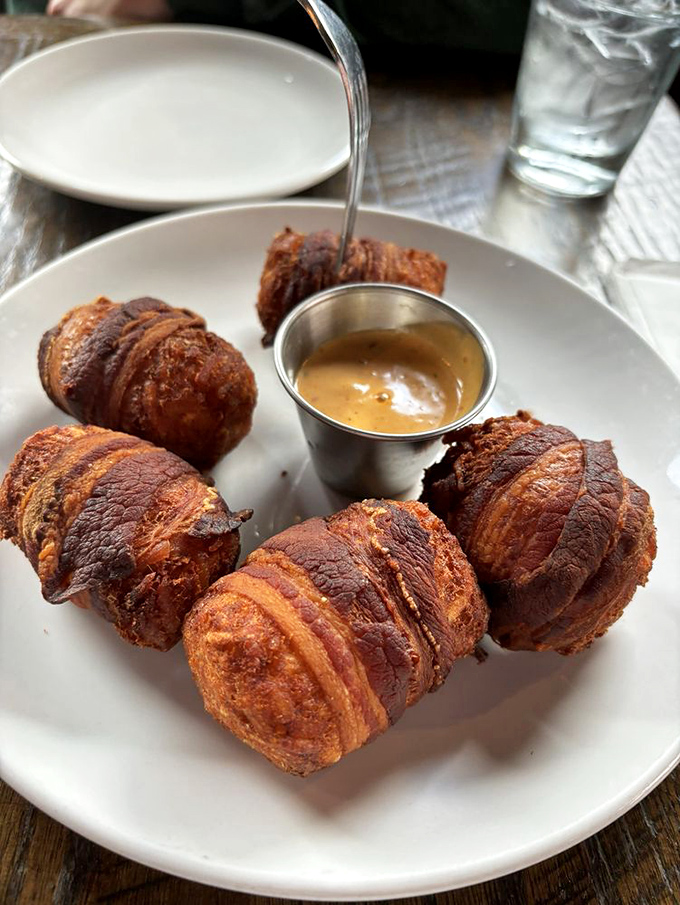 Bacon-wrapped tater tots – because sometimes regular tots just aren't indulgent enough. The dipping sauce is just showing off at this point.