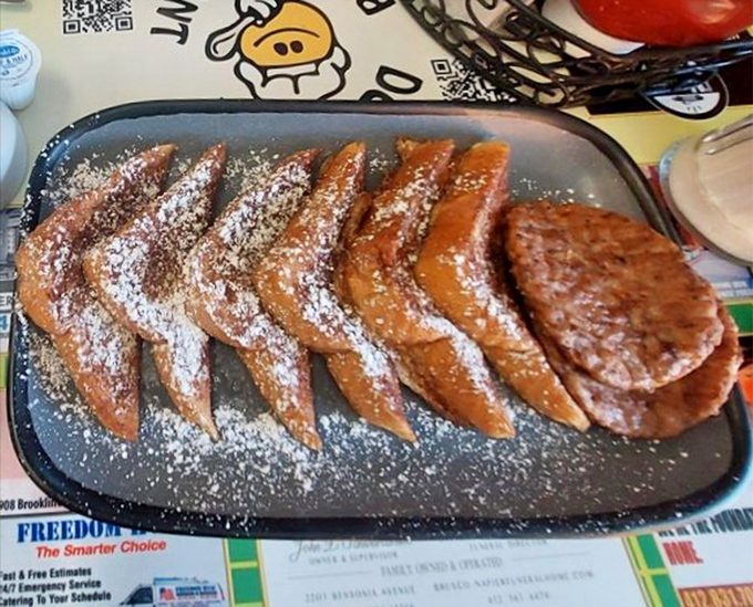 French toast that's dressed for success&mdash;powdered sugar snowfall on golden-brown perfection that makes ordinary bread feel like royalty.