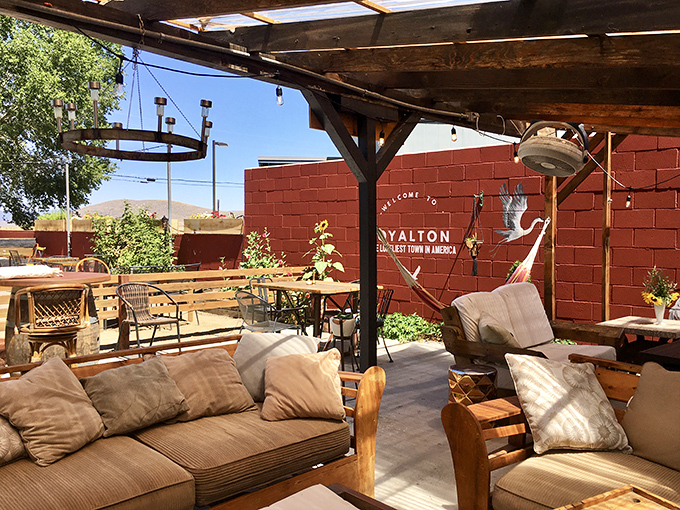 Outdoor living rooms where conversations happen face-to-face instead of screen-to-screen. The Gilded Drifter Inn's patio feels like home, only better.