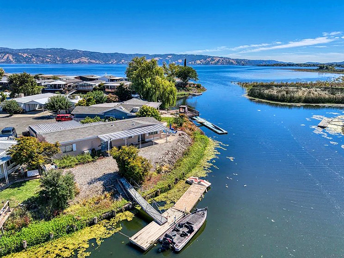 The lagoons of Lakeport offer front-row seats to nature's daily performance. Boats wait patiently for their next adventure on glass-like waters.