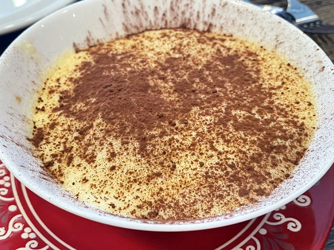 Tiramisu that would make your Italian grandmother weep with joy. The perfect ratio of coffee-soaked ladyfingers to creamy mascarpone is culinary mathematics at its finest.