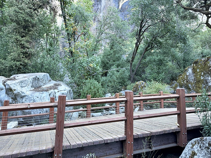 Crossing into wonder: This rustic footbridge marks the transition from everyday world to natural cathedral, where Bridalveil's mist awaits.