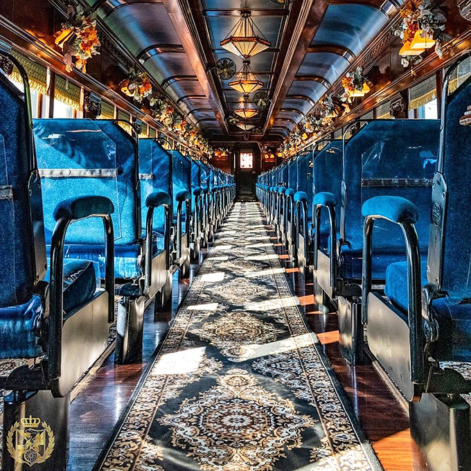 Plush blue velvet seats, ornate lighting, and carpet fit for royalty&mdash;this isn't just a train car, it's a rolling palace from another era.