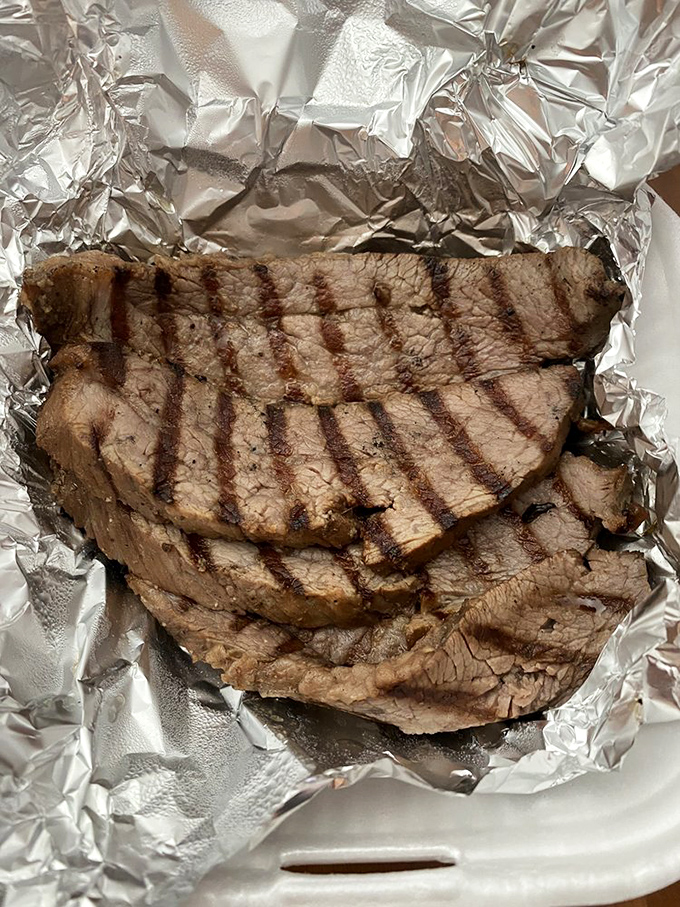Tri-tip sliced with the precision of a surgeon and the soul of a pitmaster. That smoke ring is basically barbecue jewelry.