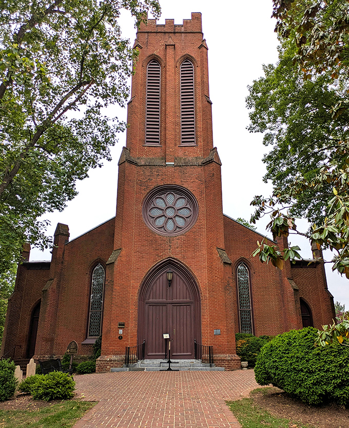 Trinity Episcopal Church stands like a Victorian gentleman in a brick suit. That rose window has witnessed more Sunday best outfits than a department store mirror.