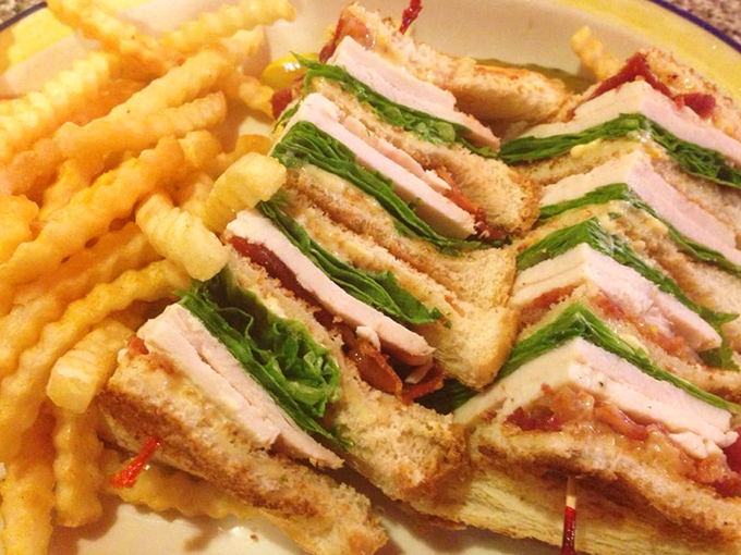Architecture students should study this club sandwich. Three perfectly constructed stories of turkey, bacon, and veggies held together by the laws of sandwich physics.