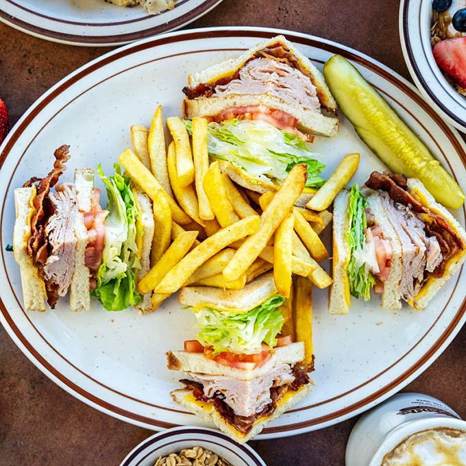 The club sandwich: where turkey, bacon, and fresh veggies come together in perfect harmony, like The Beatles of lunch options.