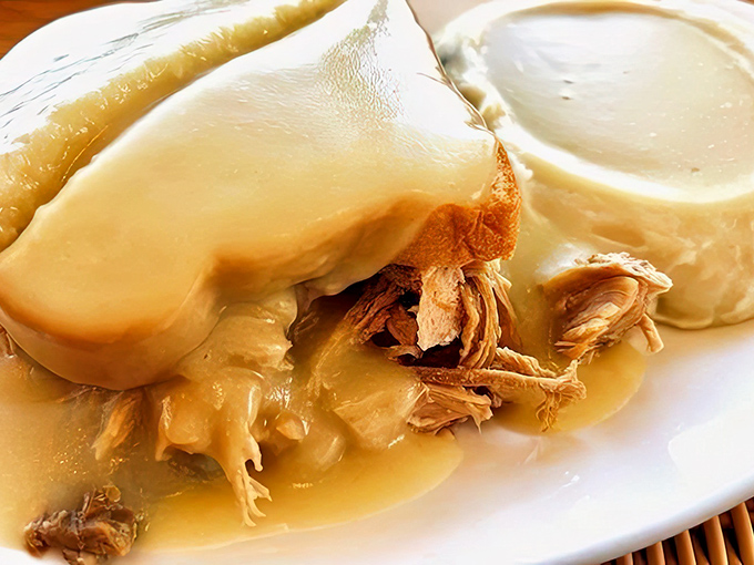 The Turkey Manhattan &ndash; where tender turkey and homemade gravy transform bread into a throne worthy of Thanksgiving royalty.